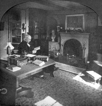 Portrait of Amos Bronson Alcott, sitting in a chair in his study ...