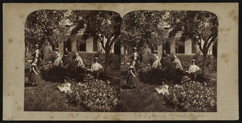 Stereograph of the T.W. Tuttle family picnicking in a garden ...