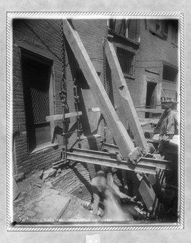 Needle beams supporting wall over sewer | Historic New England